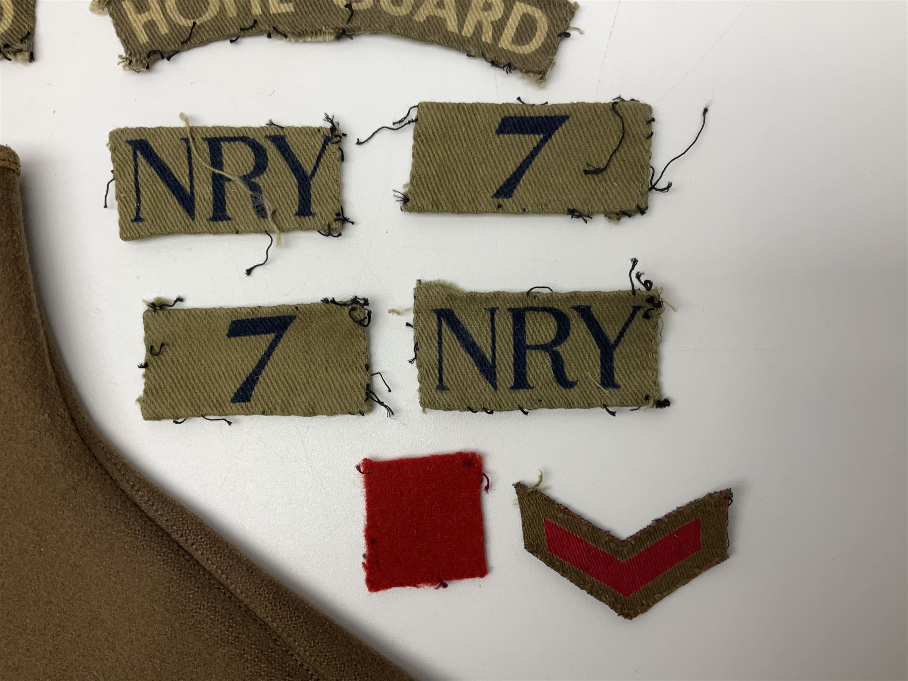 Scout's leather belt mounted with fifteen military cap/glengarry badges ...