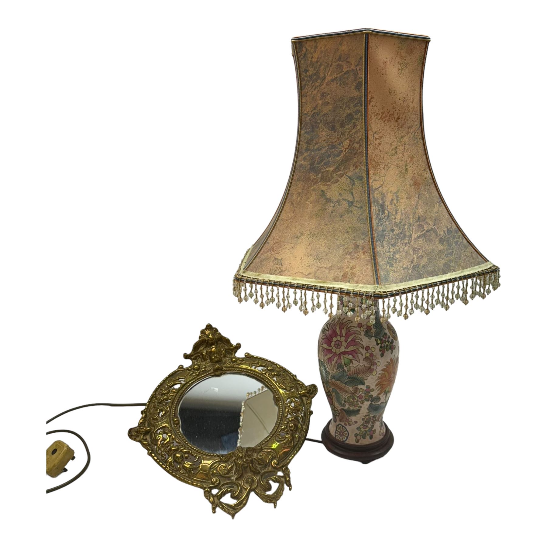 Brass circular mirror decorated with cherub and mythical masks ...