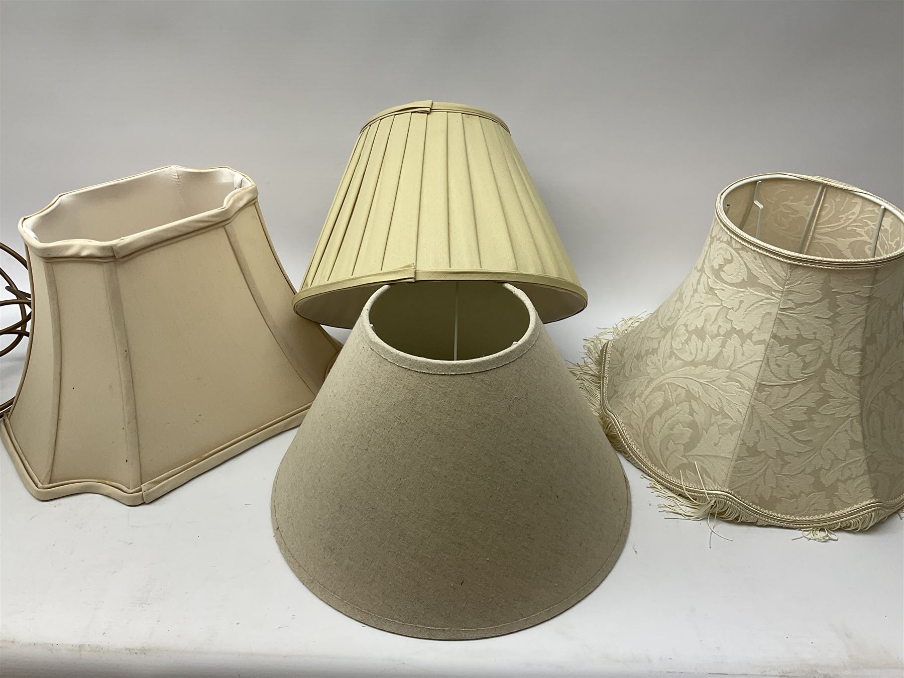 A glass and gilt metal overlaid table lamp, of bulbous form, with light ...