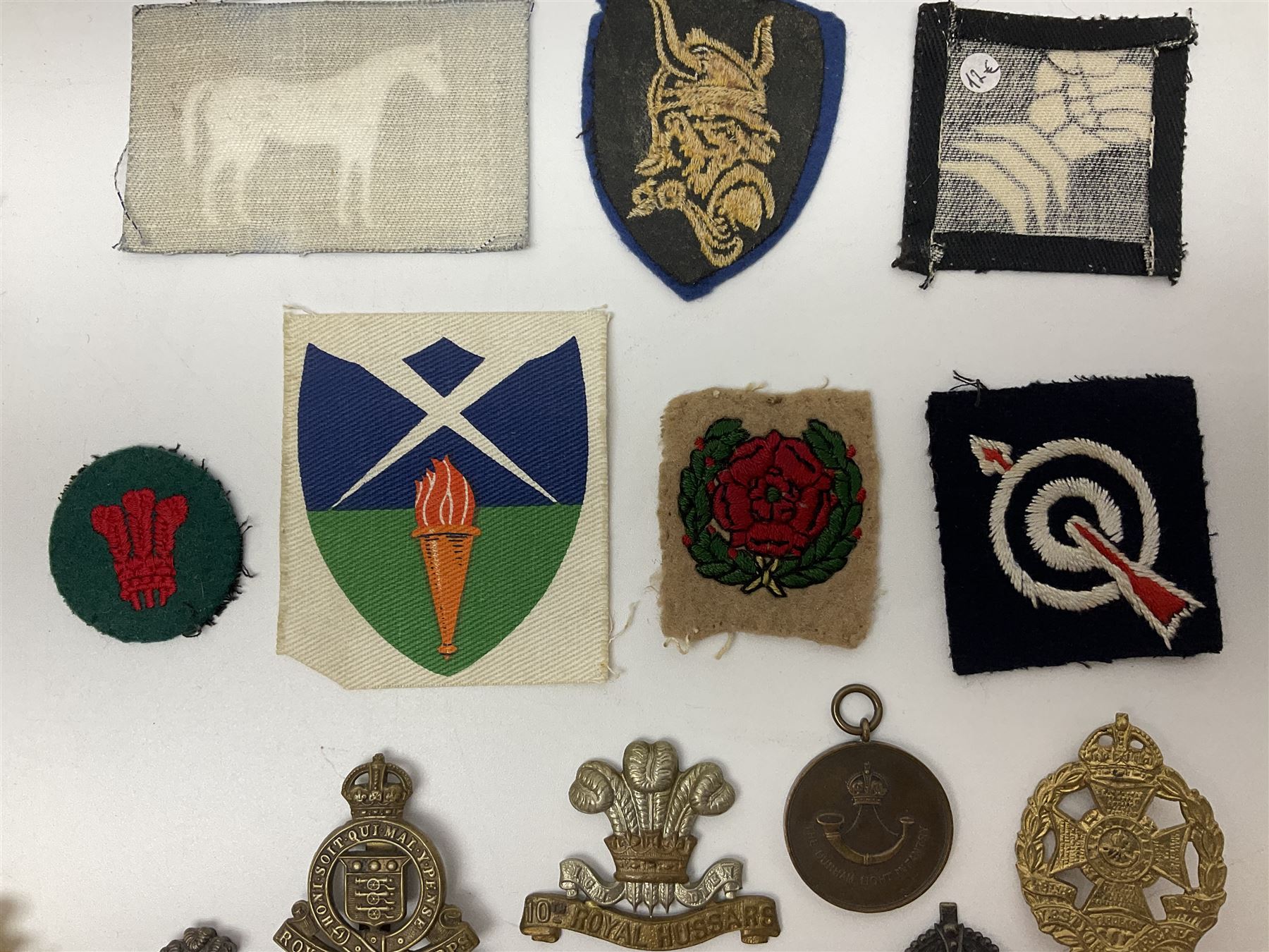 Thirty-six British metal and cloth badges including RAOC, Wiltshire ...