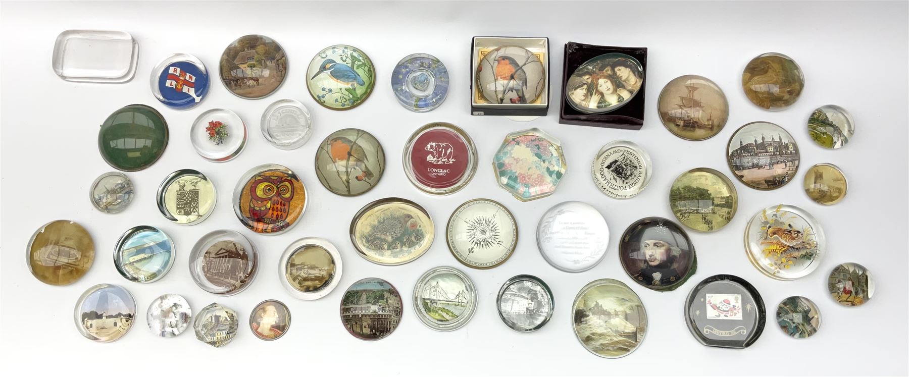 A large collection of glass paperweights, to include souvenir examples ...