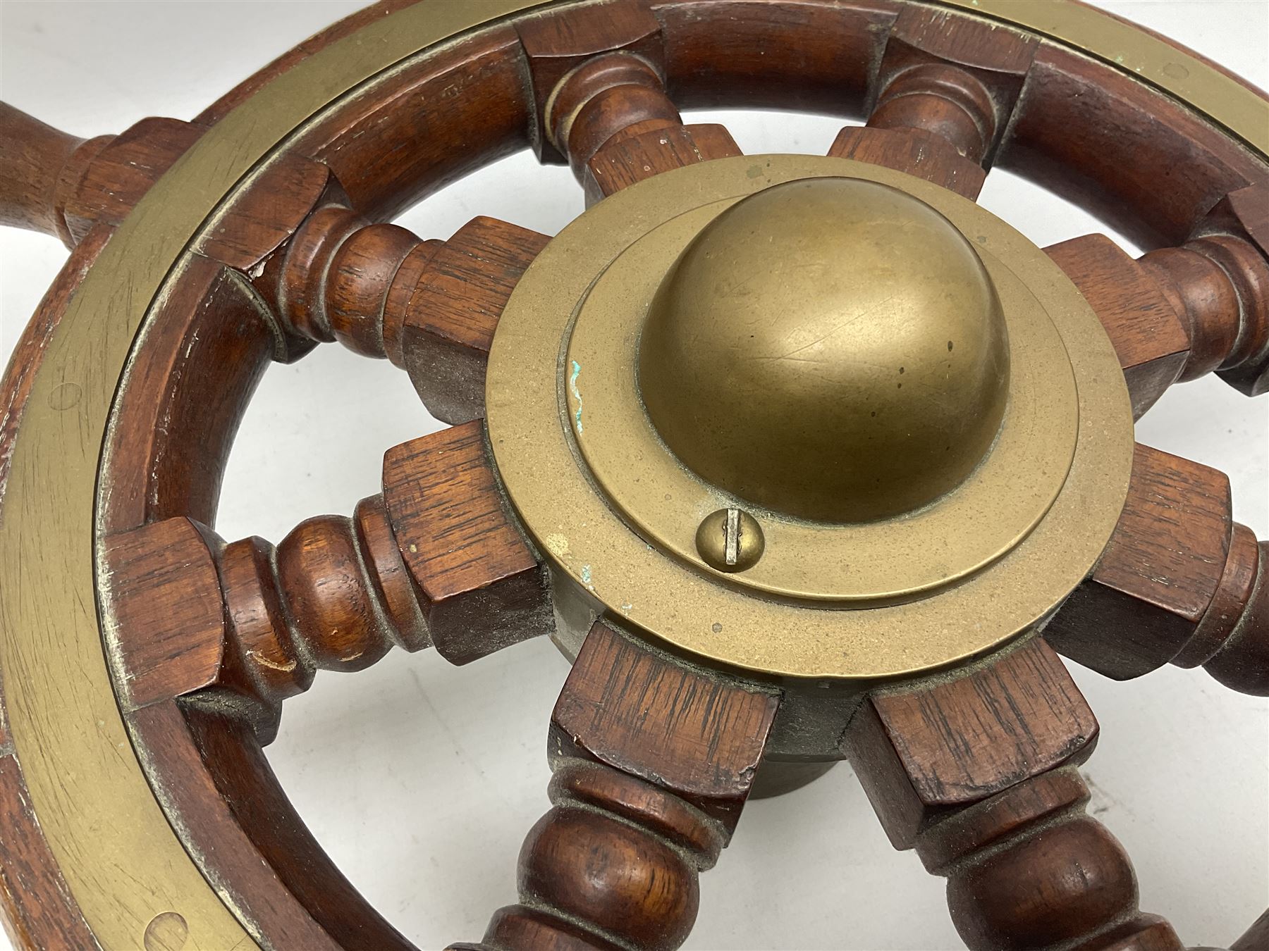 Brass bound teak ship's wheel with eight turned spokes and brass hub ...
