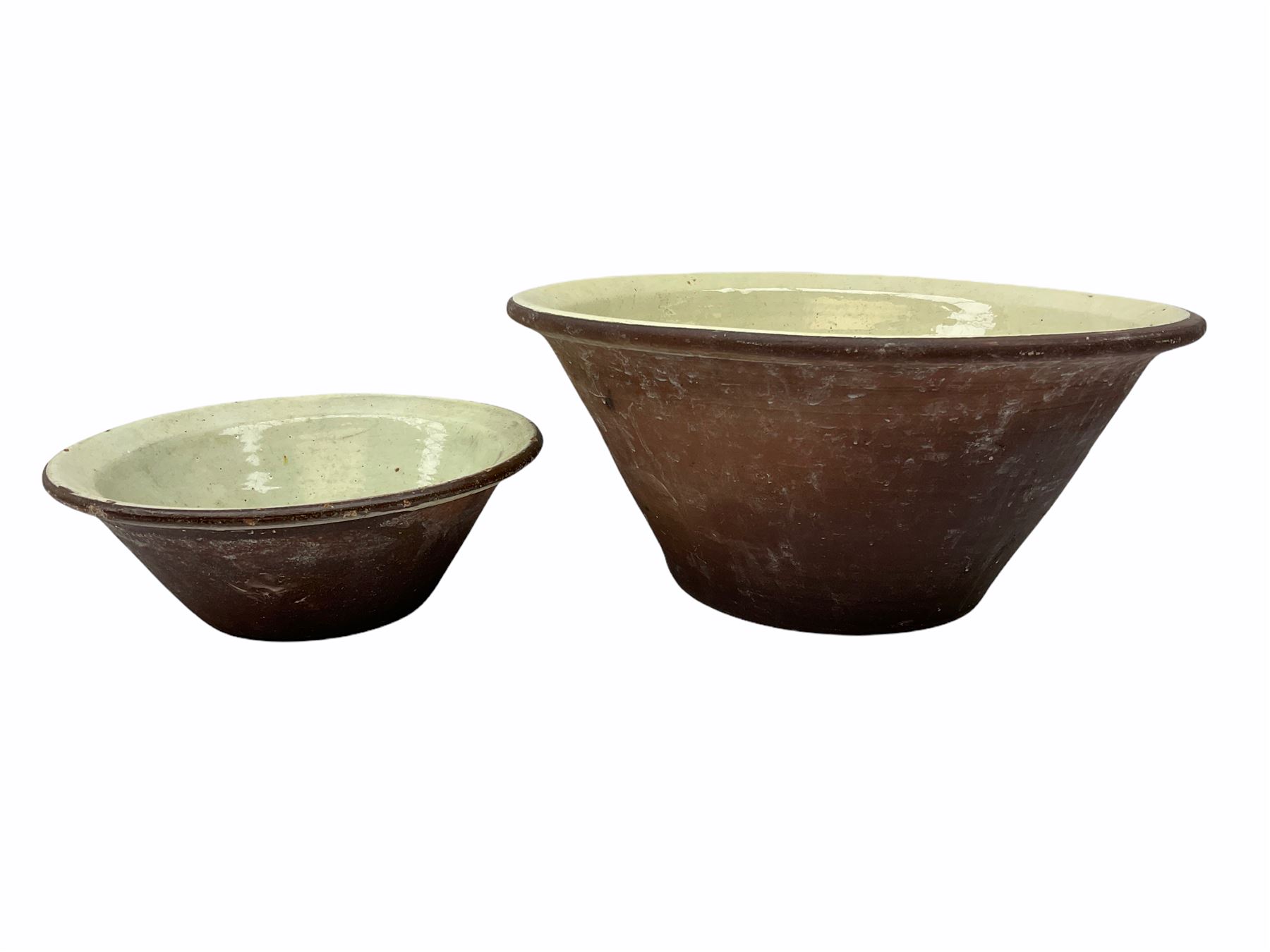 Late 19th century bread pancheon, with unglazed exterior and cream ...