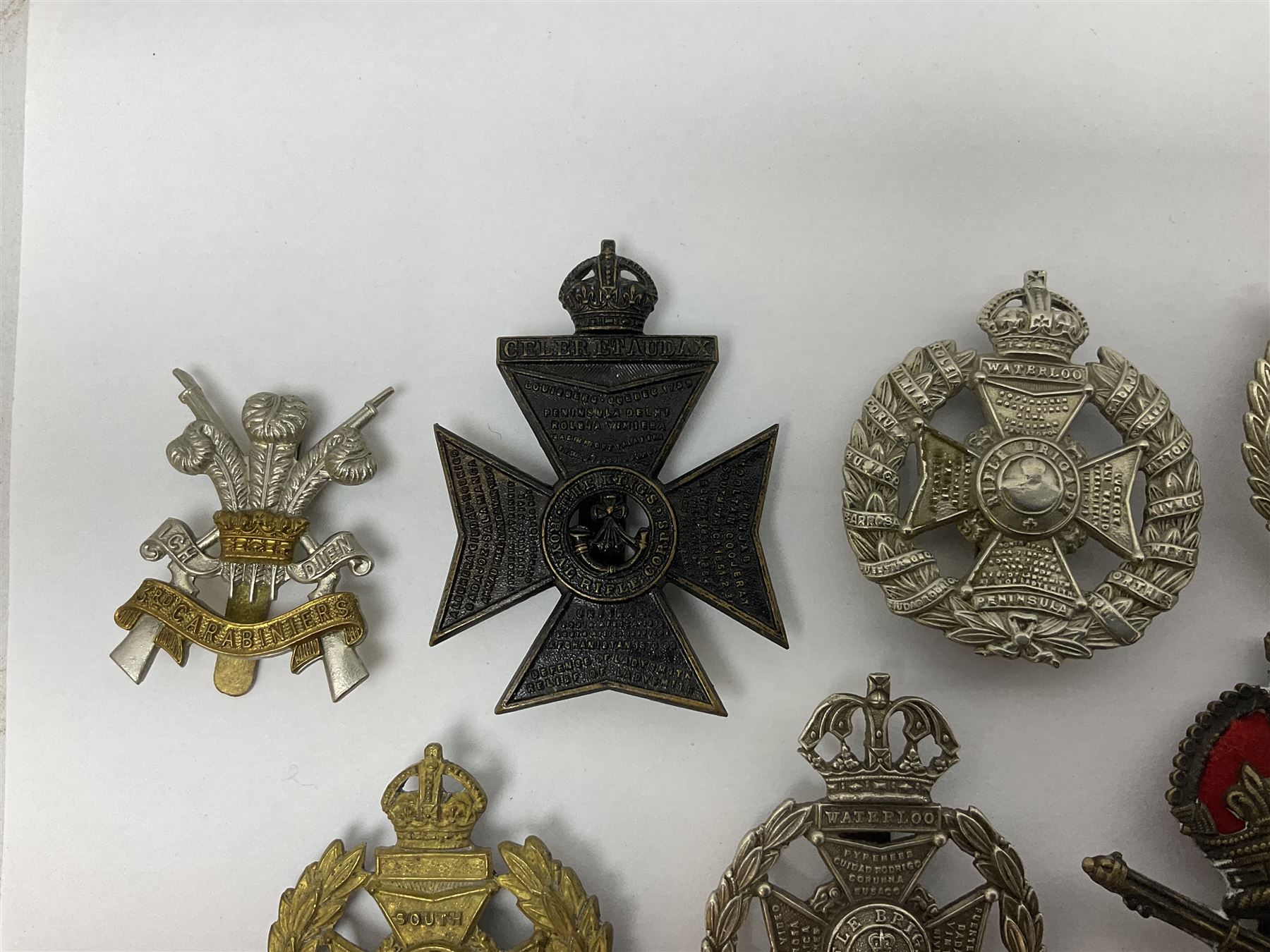 Twenty various cap badges including Rifle Brigade, Machine Gun Corps ...