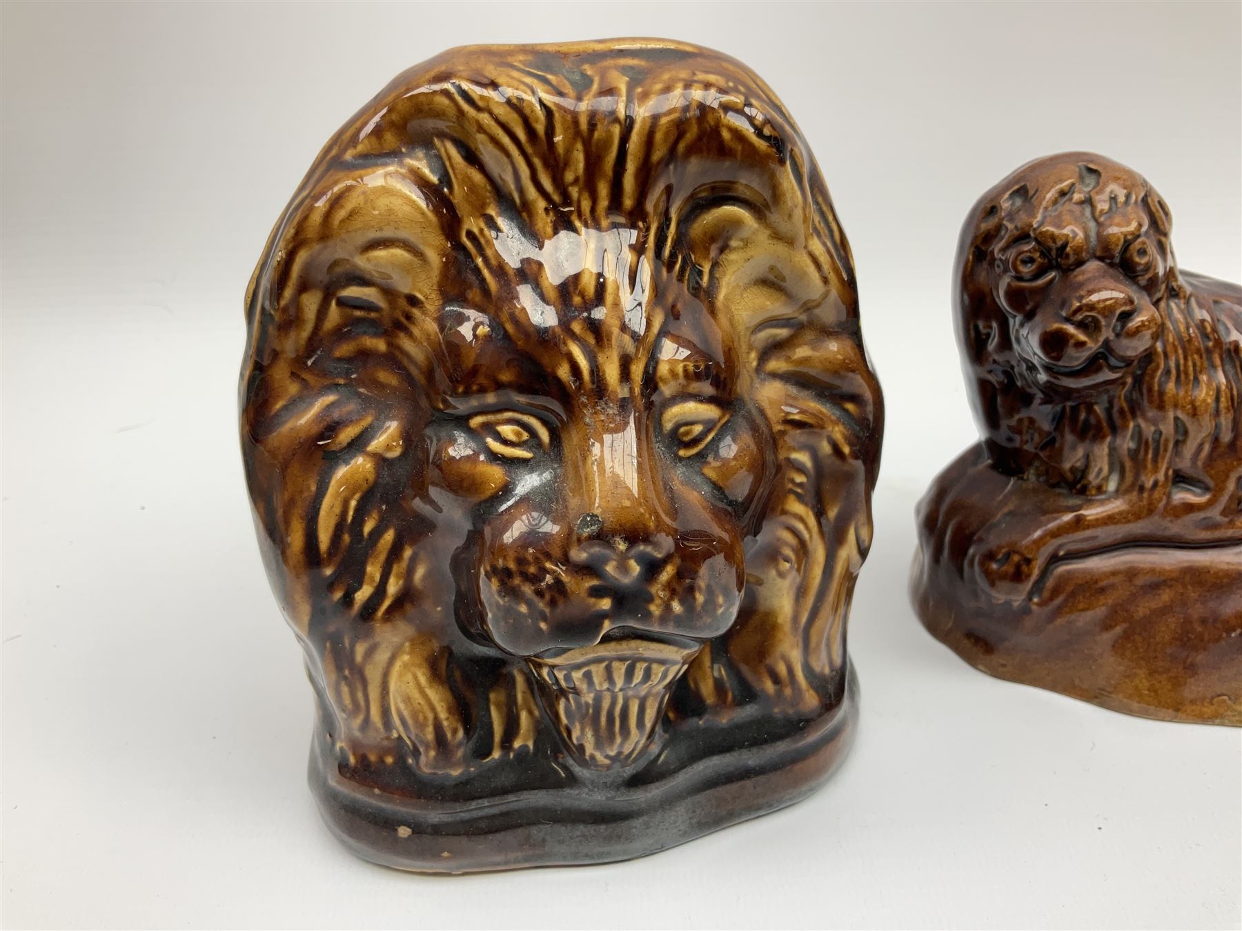 Two 19th century treacle glaze furniture/sash window rests modelled as ...