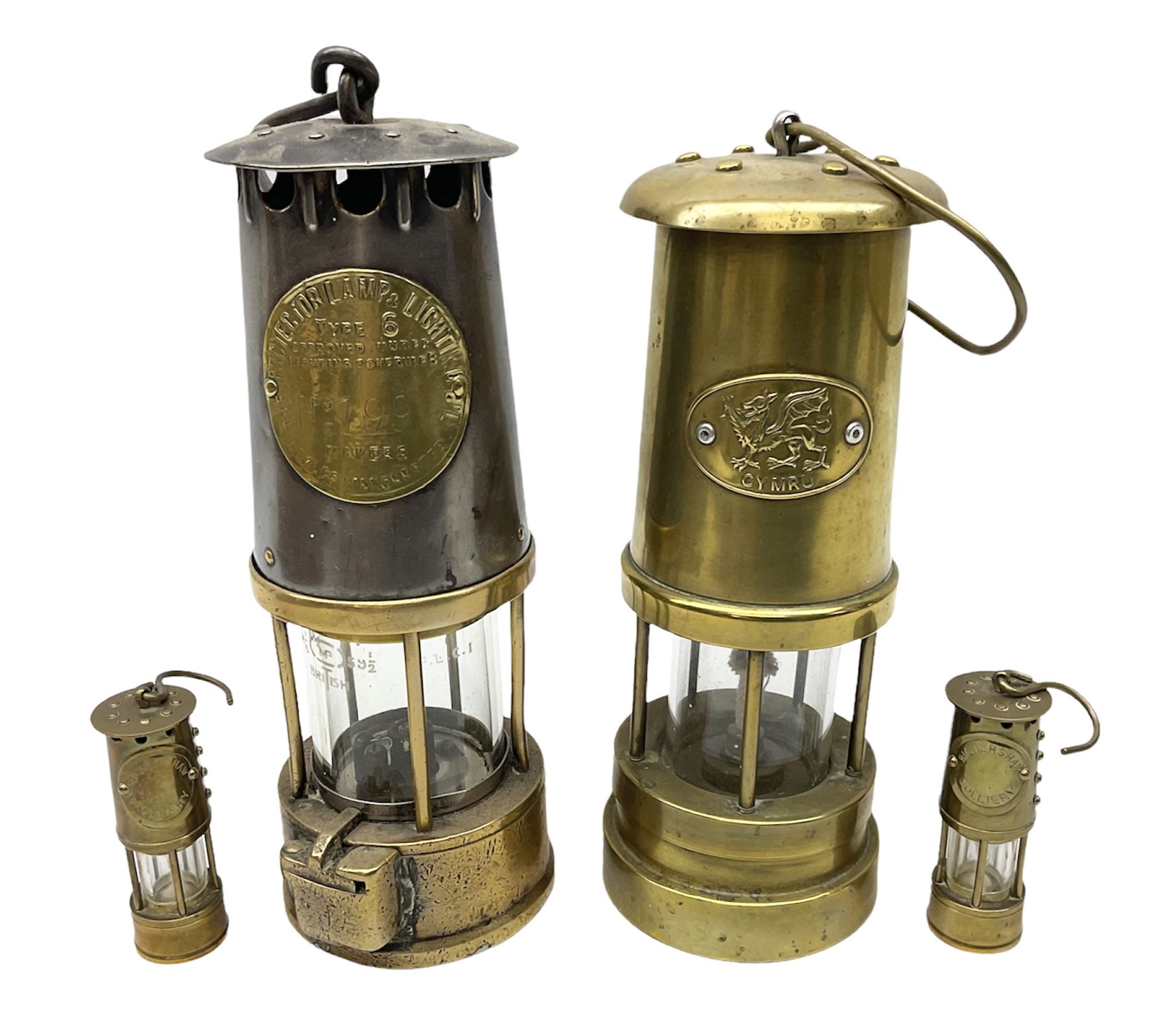 Two brass miners lamps to include an Eccles Manchester Type 6 example ...