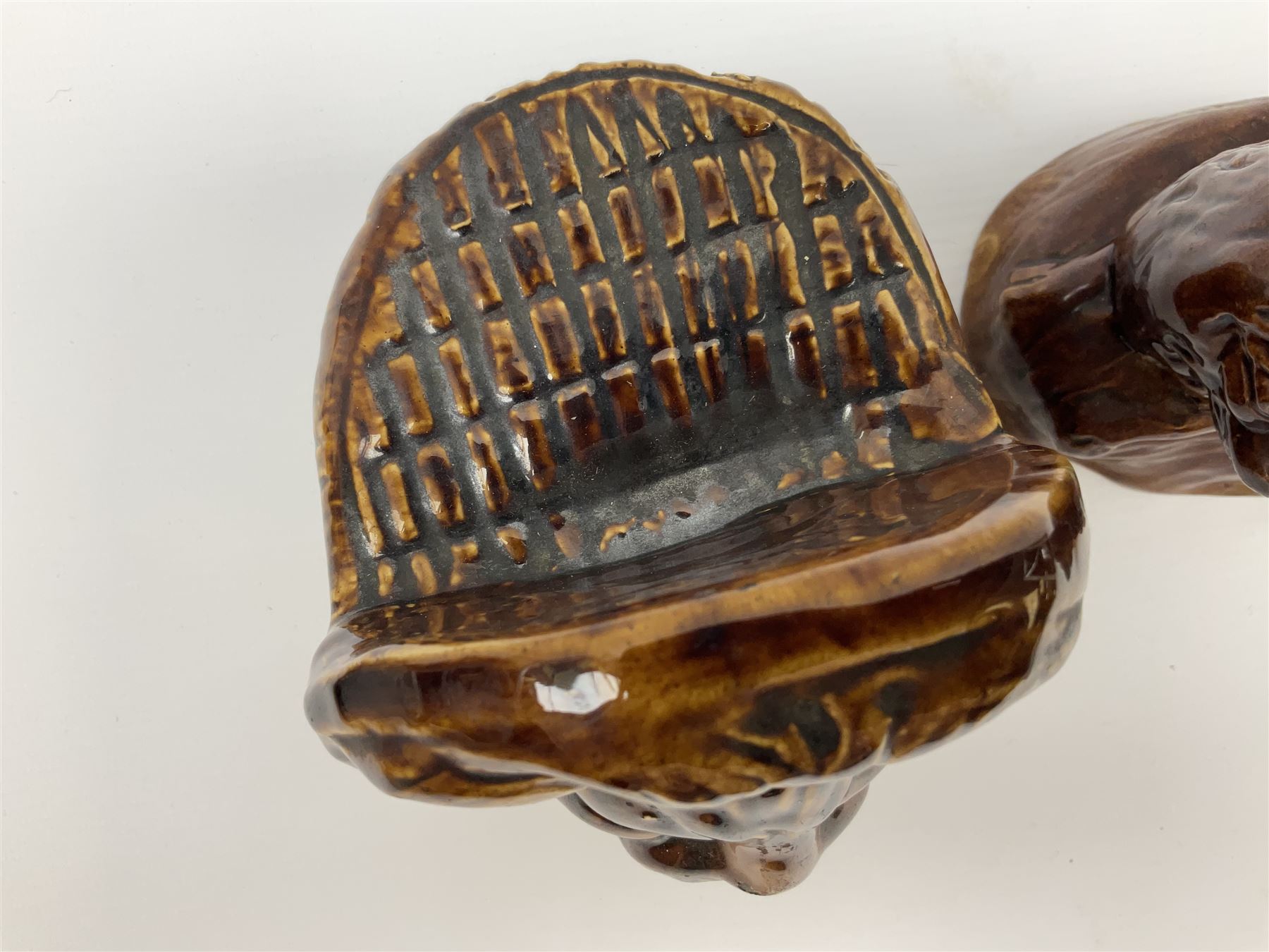 Two 19th century treacle glaze furniture/sash window rests modelled as ...