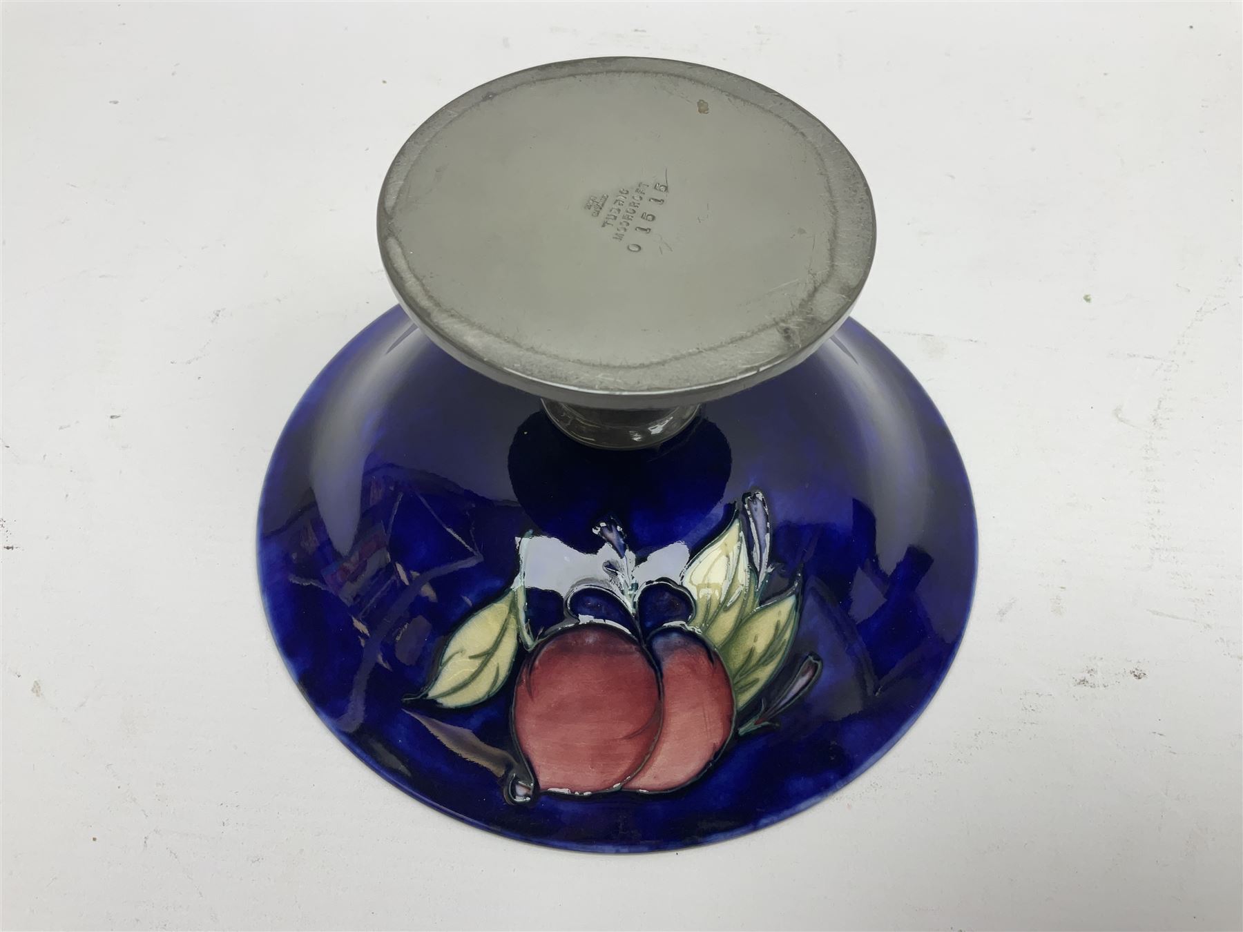 Moorcroft small pedestal dish decorated in the Wisteria pattern against ...