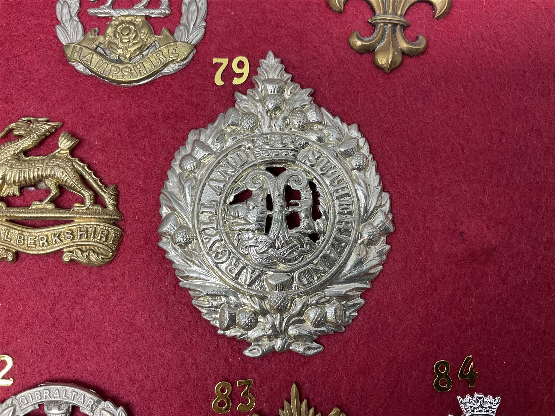 Twenty-two glengarry and cap badges including Argyll & Sutherland ...