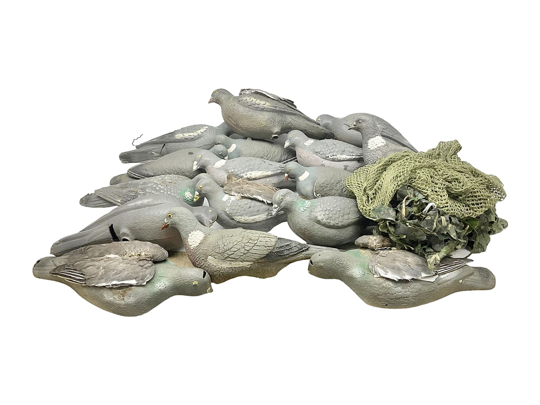Fourteen Wood Pigeon decoys, together with camouflage netting ...