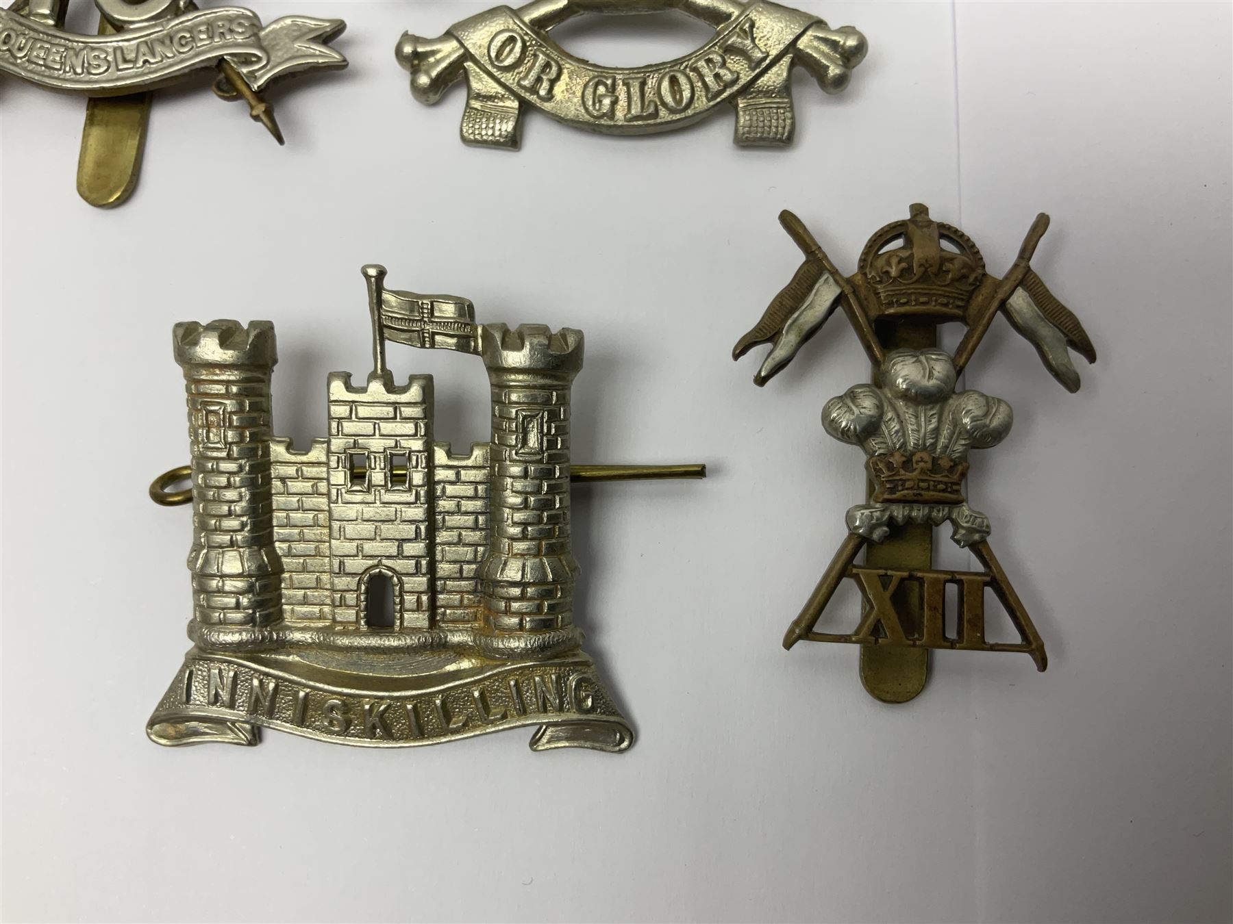 Seven cap badges for Lancers and Dragoons including 9th | Militaria | 94435