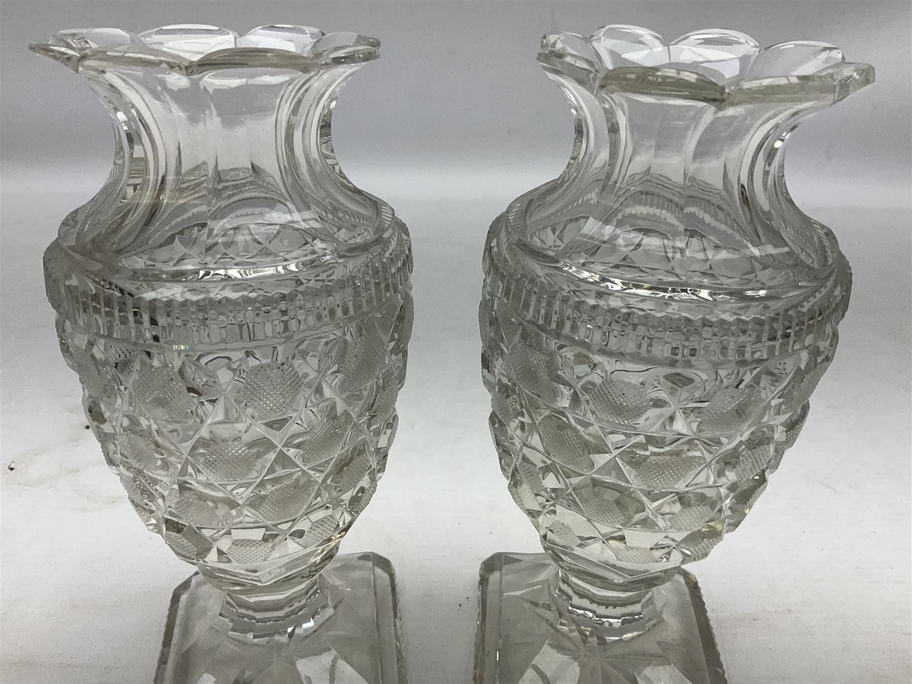 Pair of early 19th century heavy cut glass vases, the bodies of urn ...