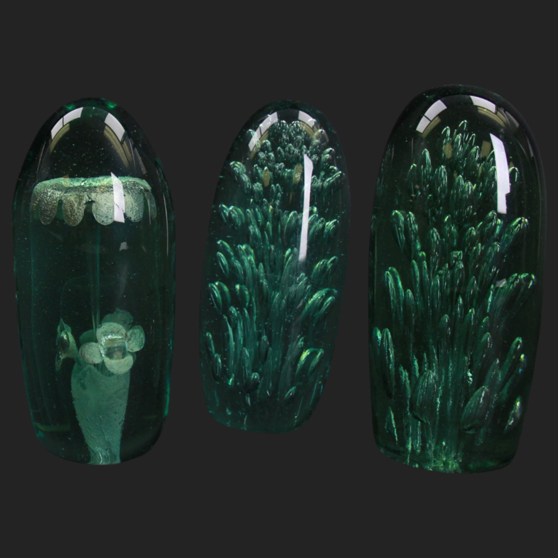 Three Victorian green glass dump paperweight two with air bubble ...