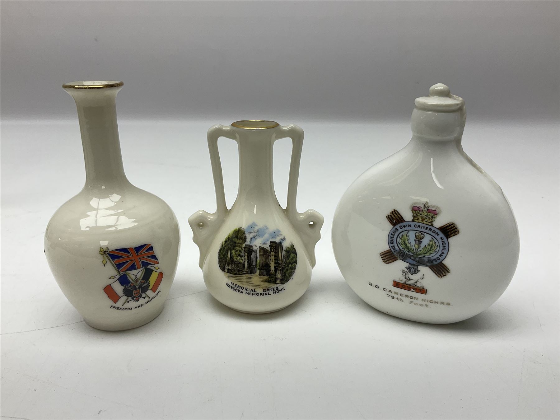 Eighteen WW1 crested china military models including artillery shells ...