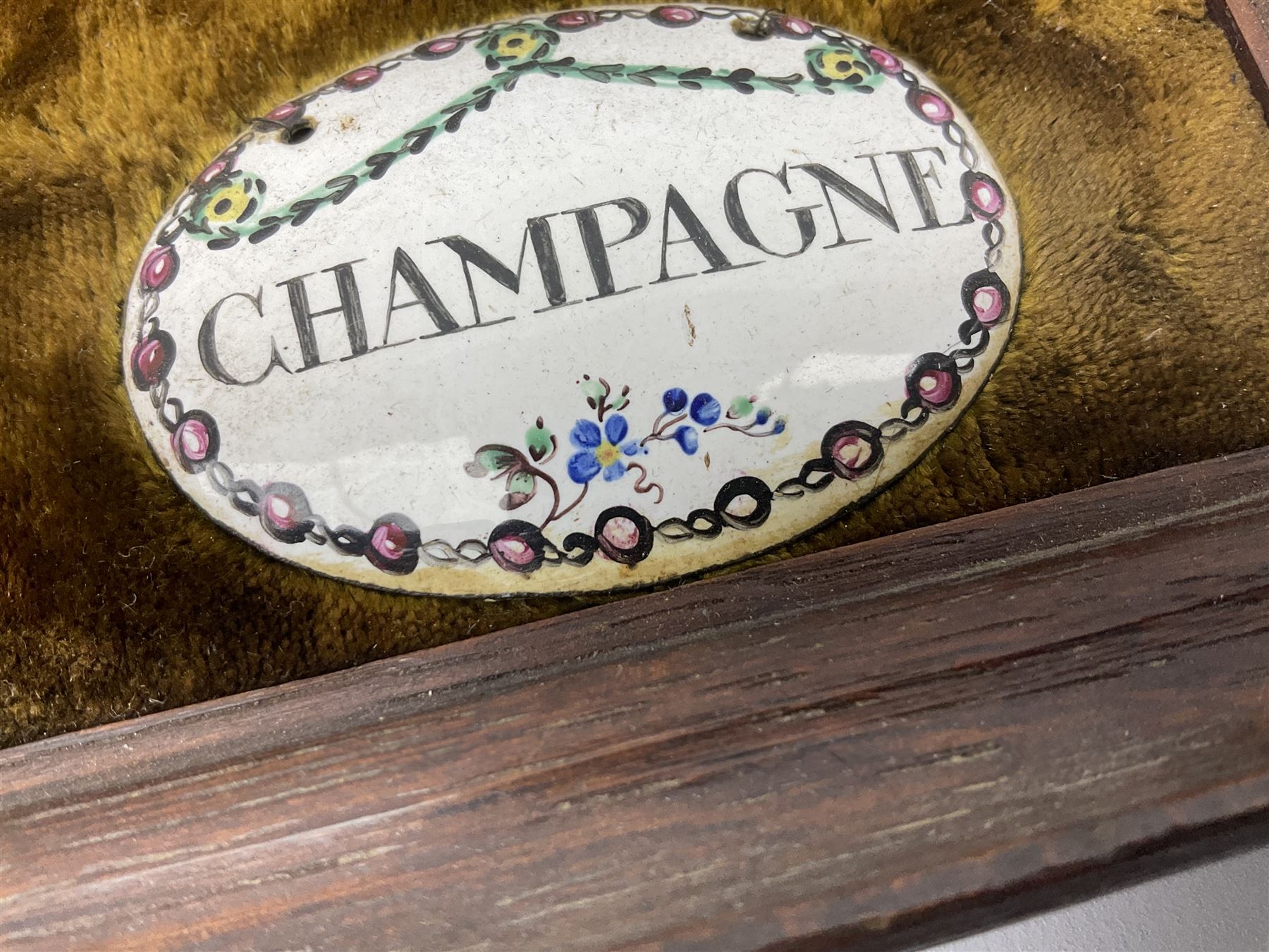 Collection of twenty one 18th and 19th century enamel wine labels and ...