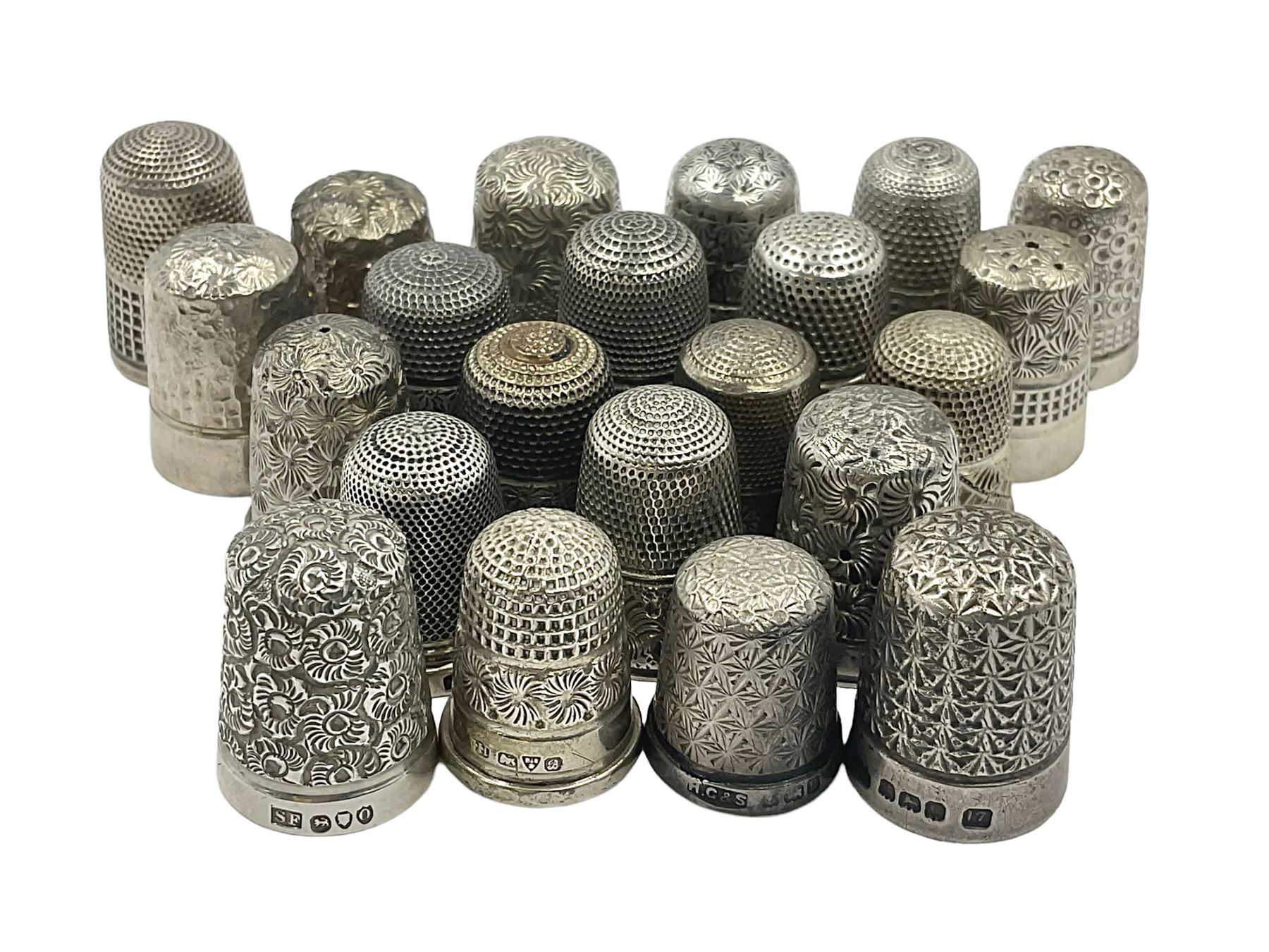Collection of twenty-two Victorian and later silver thimbles, including ...