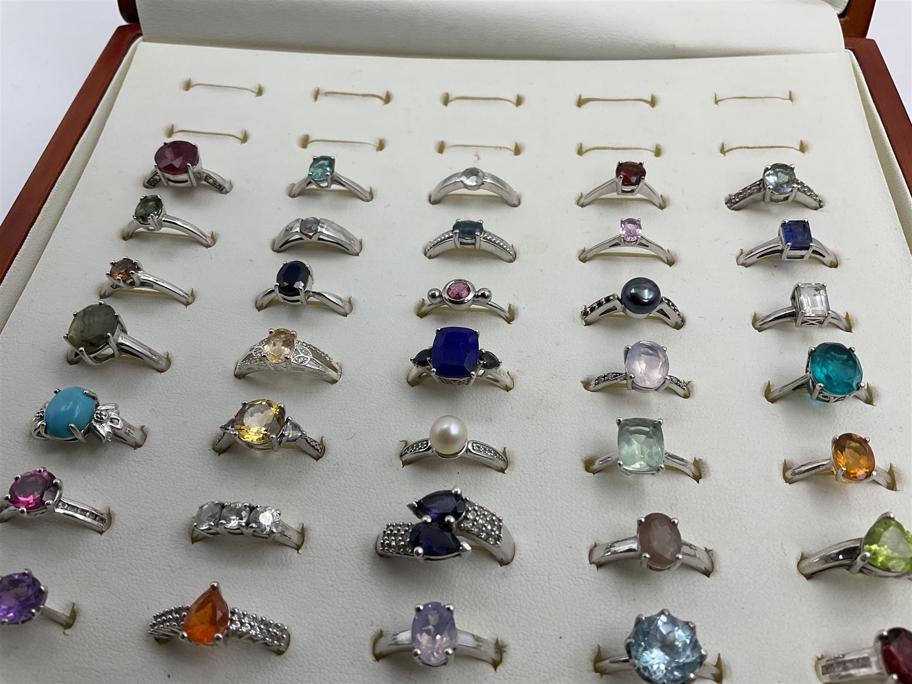 Forty silver stone-set rings, including ruby, topaz, pearl, labradorite ...