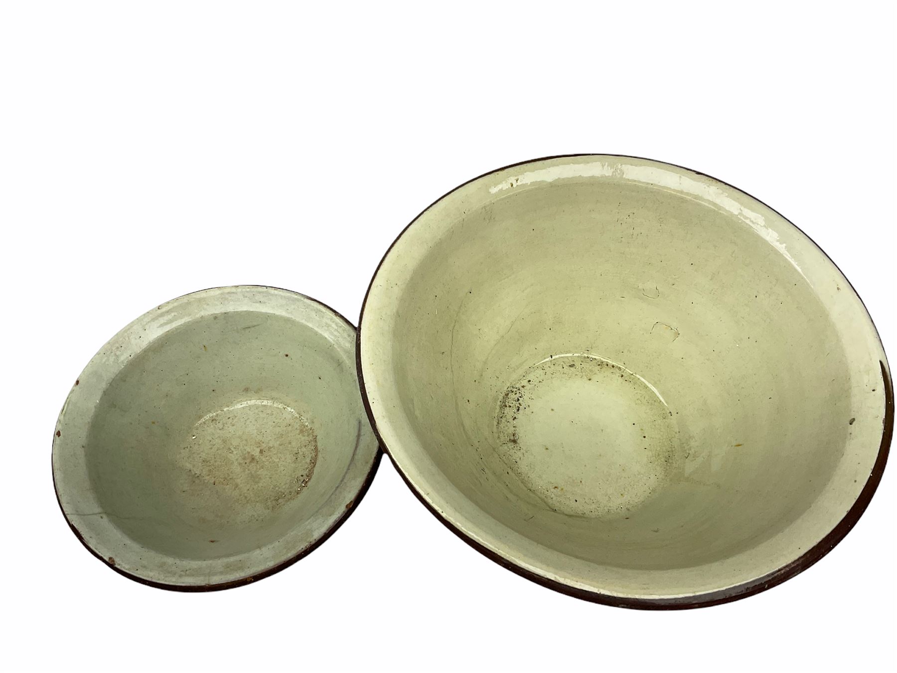 Late 19th century bread pancheon, with unglazed exterior and cream ...
