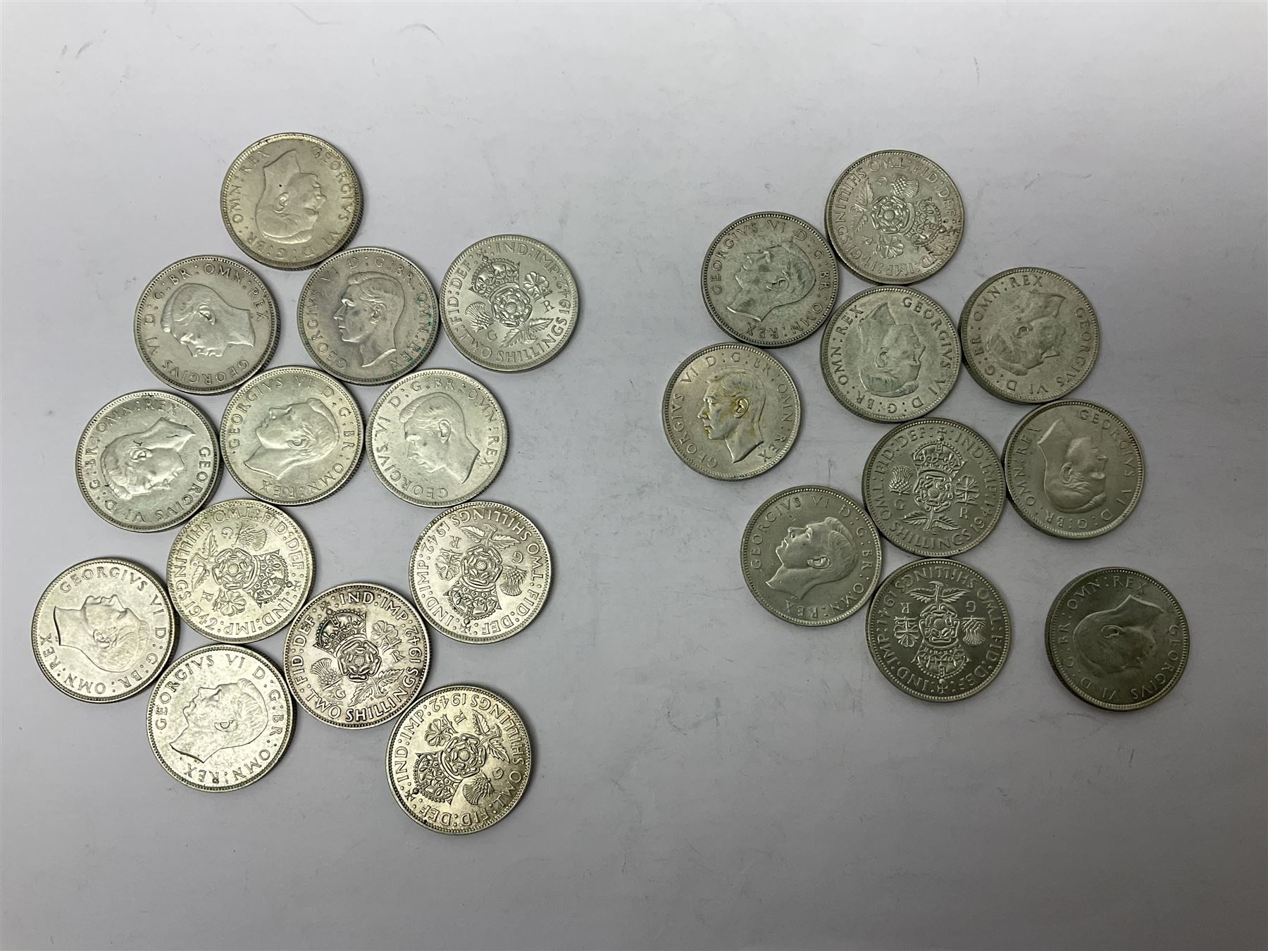Twenty-three King George VI pre 1947 silver two shilling coins, dated ...