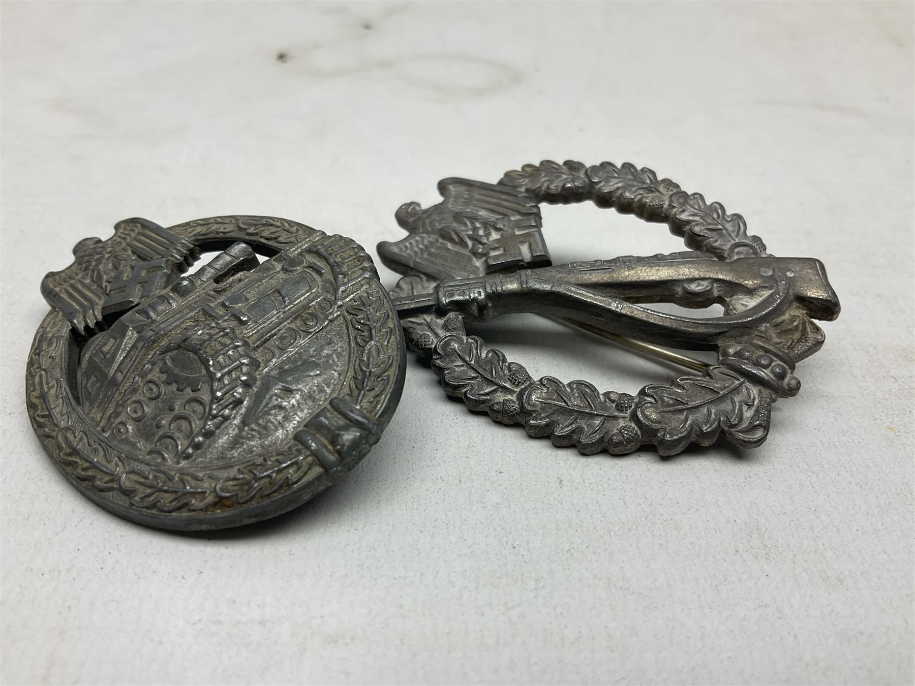 Four German badges comprising Infantry Assault badge; two Tank Battle ...