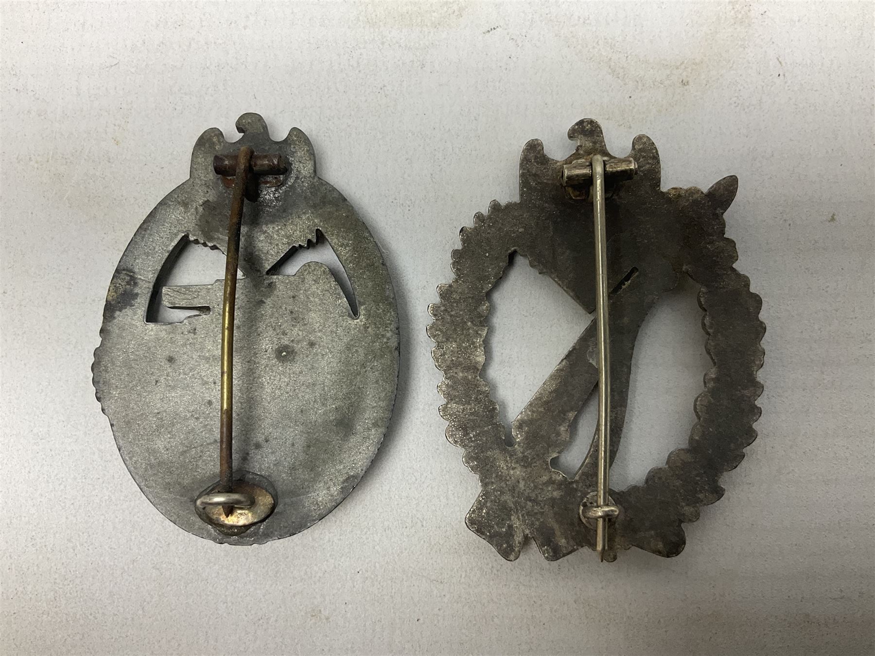 Four German badges comprising Infantry Assault badge; two Tank Battle ...