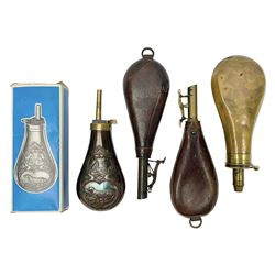 Two brass mounted leather shot flasks with thumb action nozzles; Dixon ...