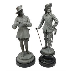 Matched pair of unpainted spelter figures of cavaliers - one standing ...