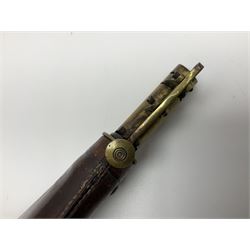 Two brass mounted leather shot flasks with thumb action nozzles; Dixon ...