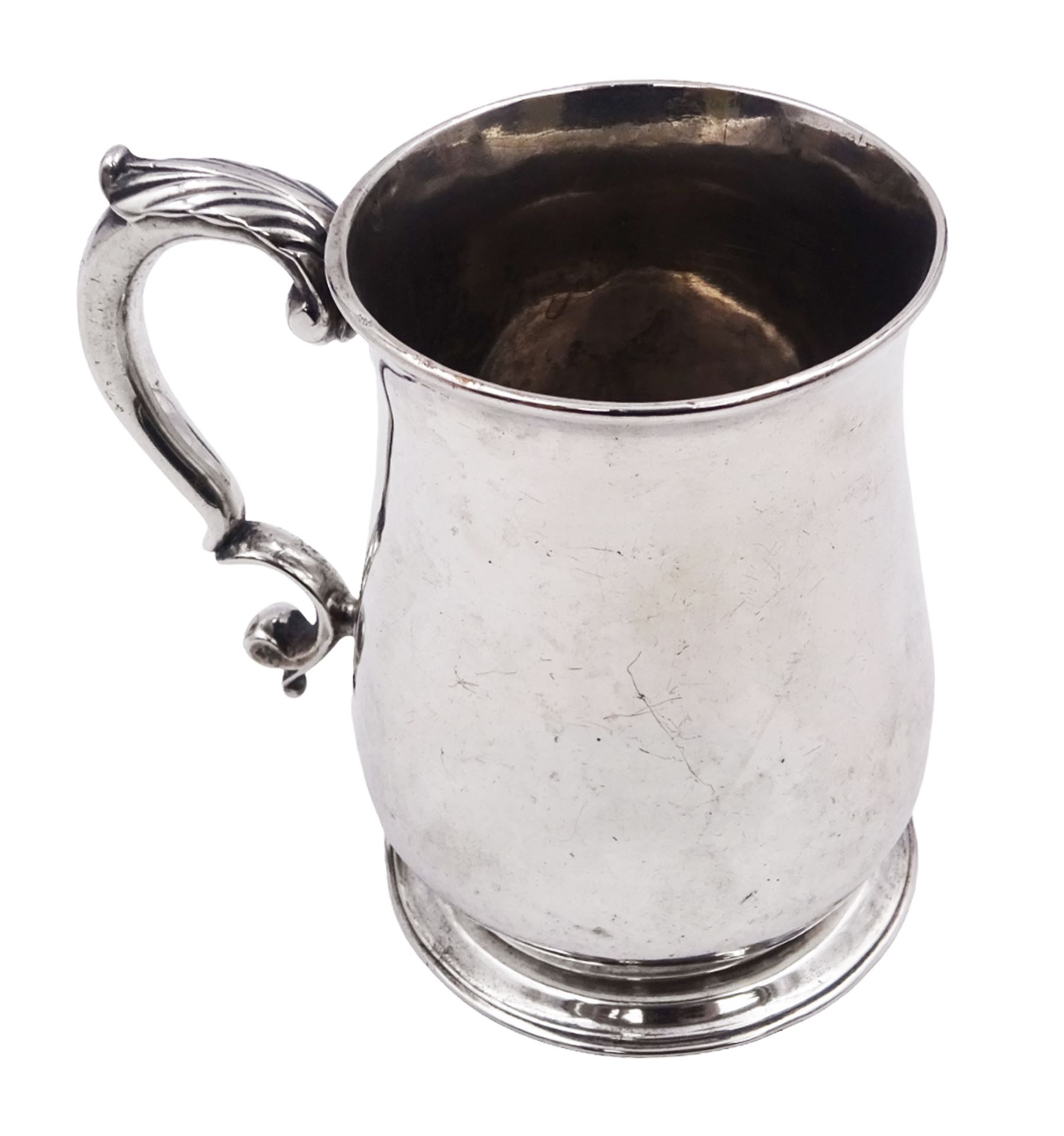 George II silver tankard, of baluster form, with acanthus leaf capped ...