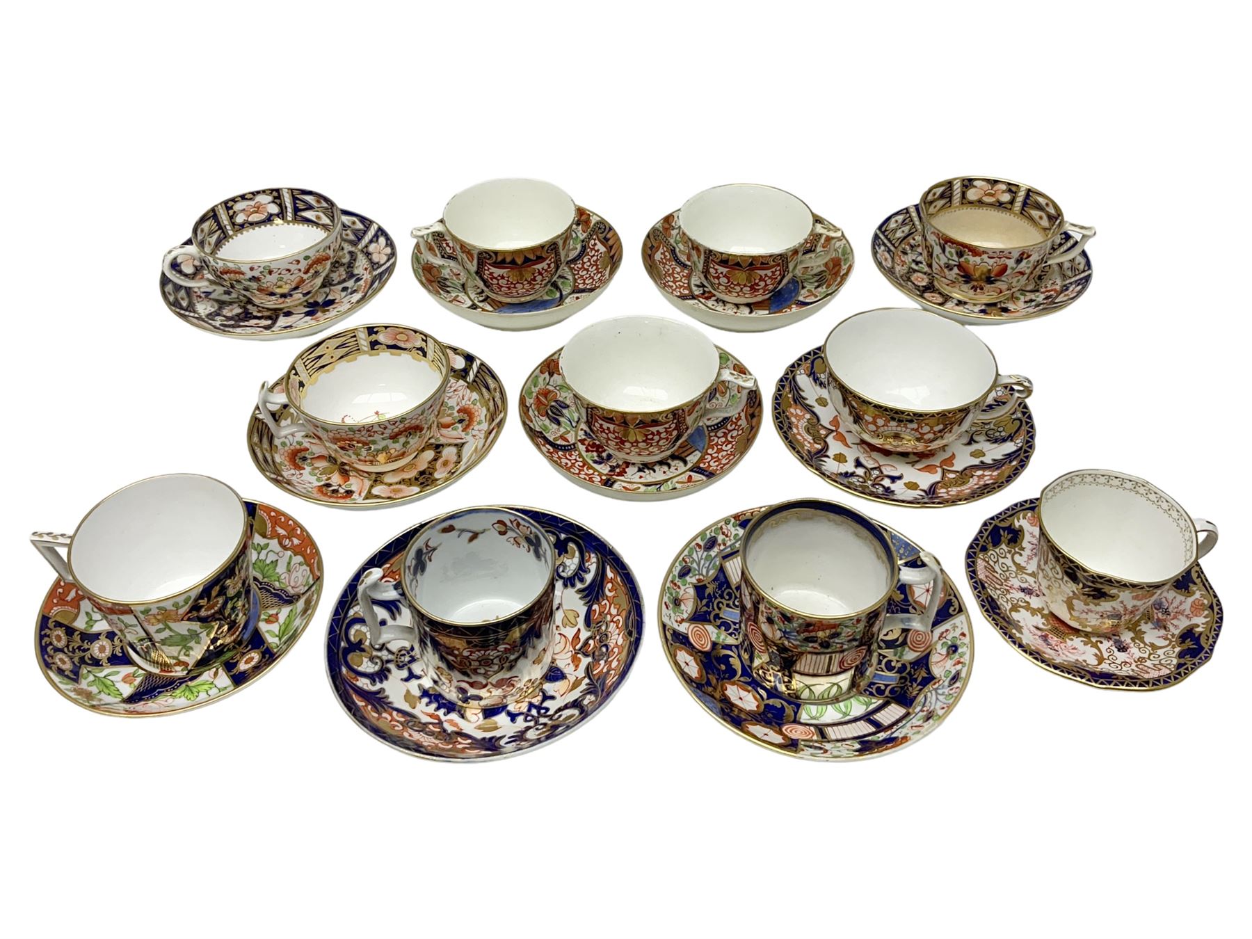 Early 19th century and later, eleven Royal Crown derby teacups and saucers in various patterns ...