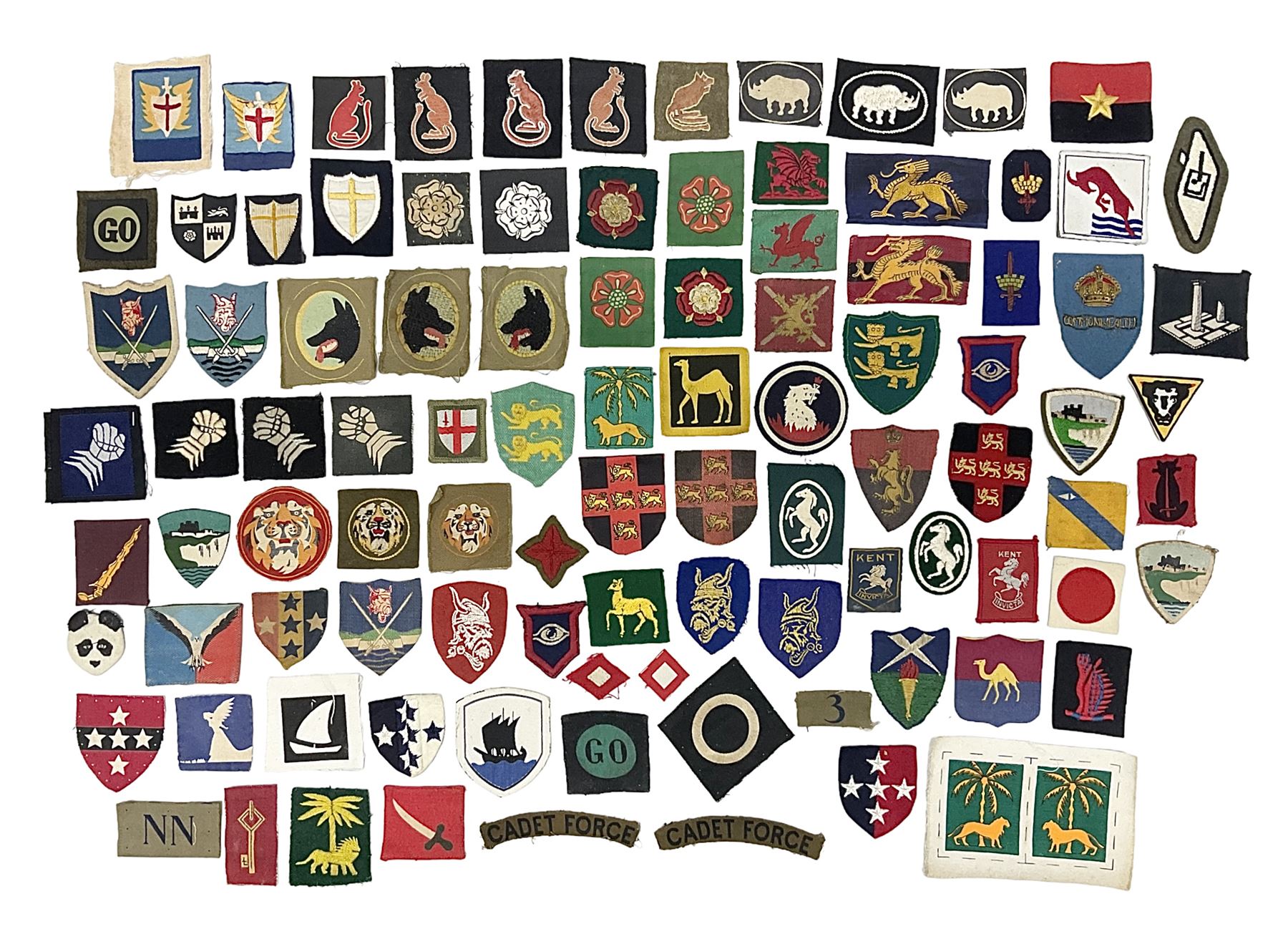 Approximately one-hundred printed and embroidered cloth badges ...